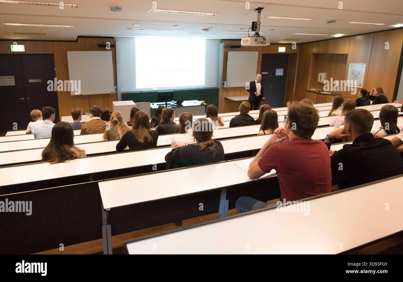 students sitting in a lecture at a university, education and knowledge ...