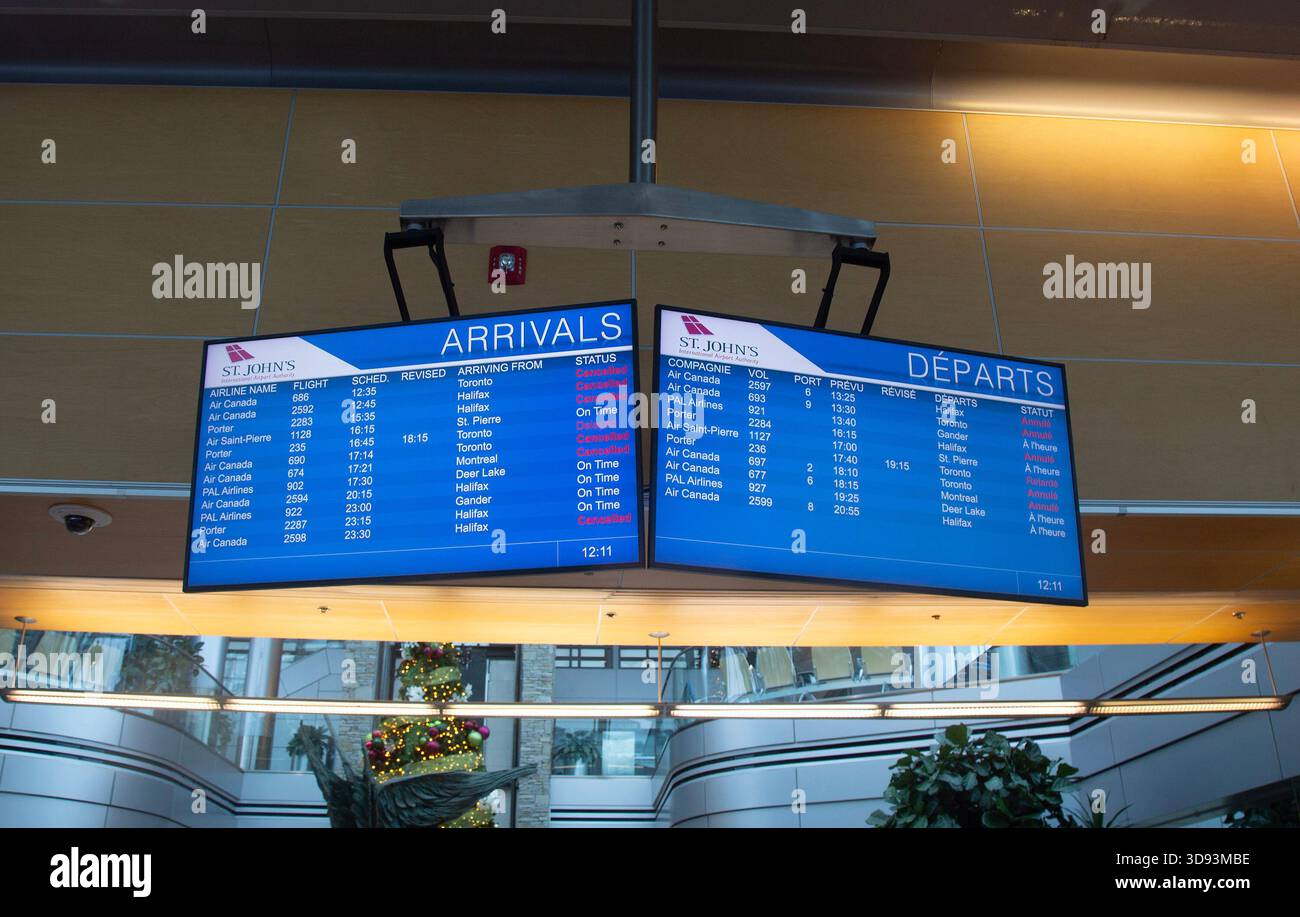 A flight status screen shows cancelled and delayed flights into an out ...