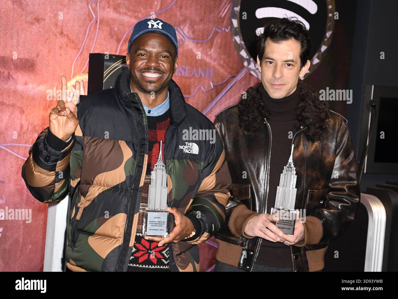 NEW YORK, NY - DECEMBER 3: Xavier "X" Jernigan and Mark Ronson lights ...