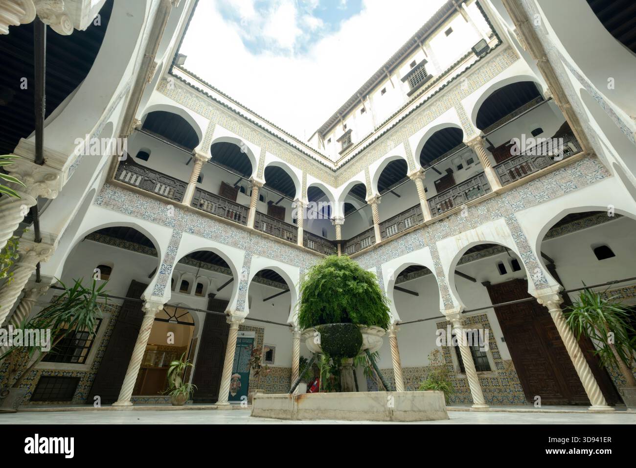 Ancient islamic architecture features arches, columns, and a central ...