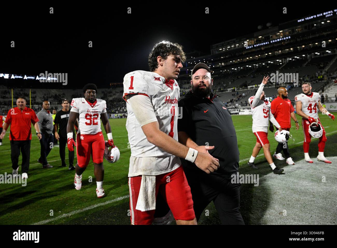 Houston quarterback Conner Weigman (1) leaves the field with special ...