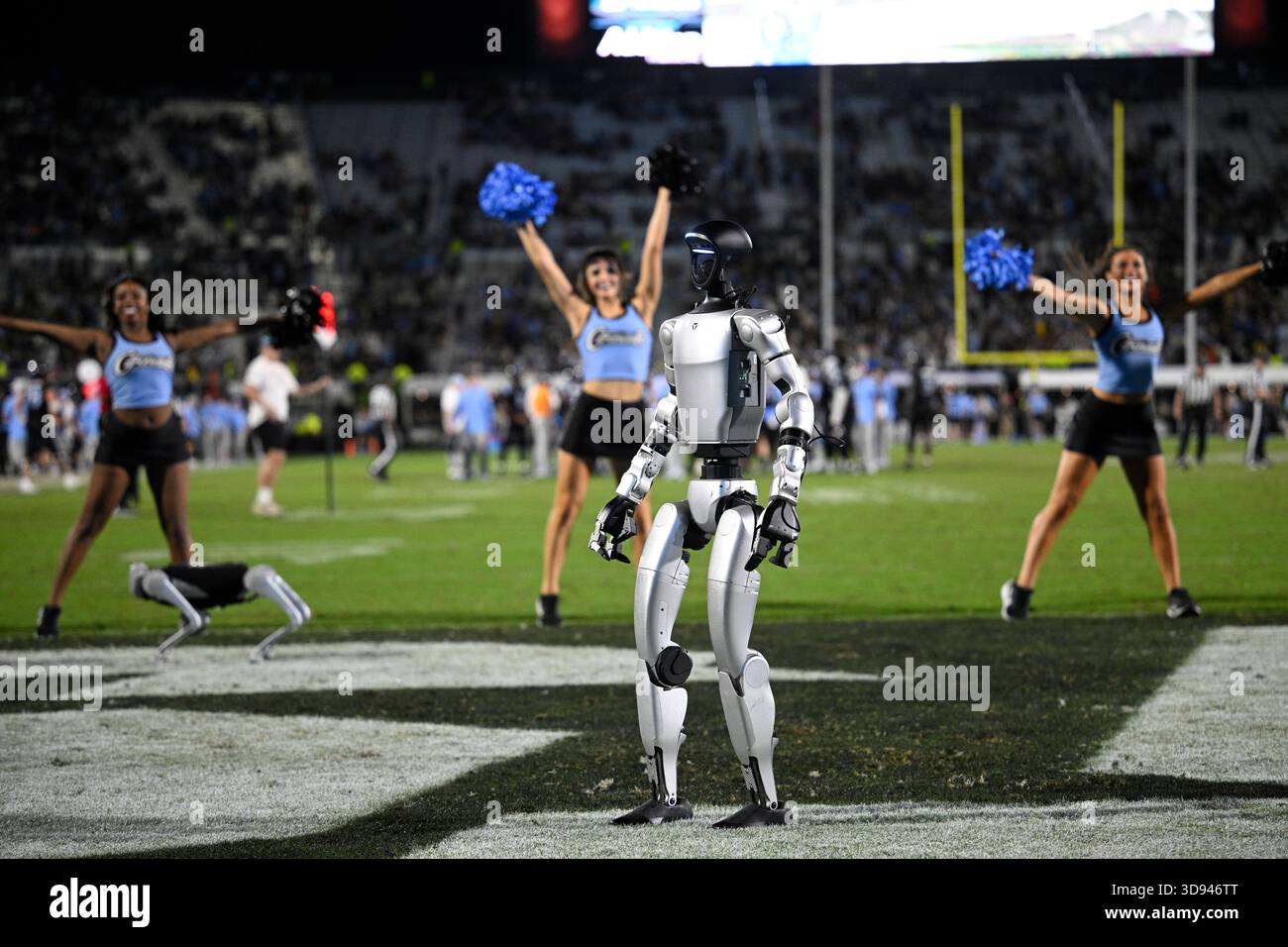 Robots perform in the end zone during the second half of an NCAA ...