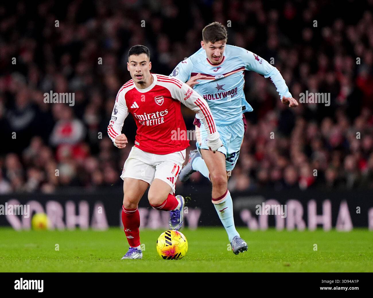 Arsenal's Gabriel Martinelli (left) and Brentford's Vitaly Janelt ...