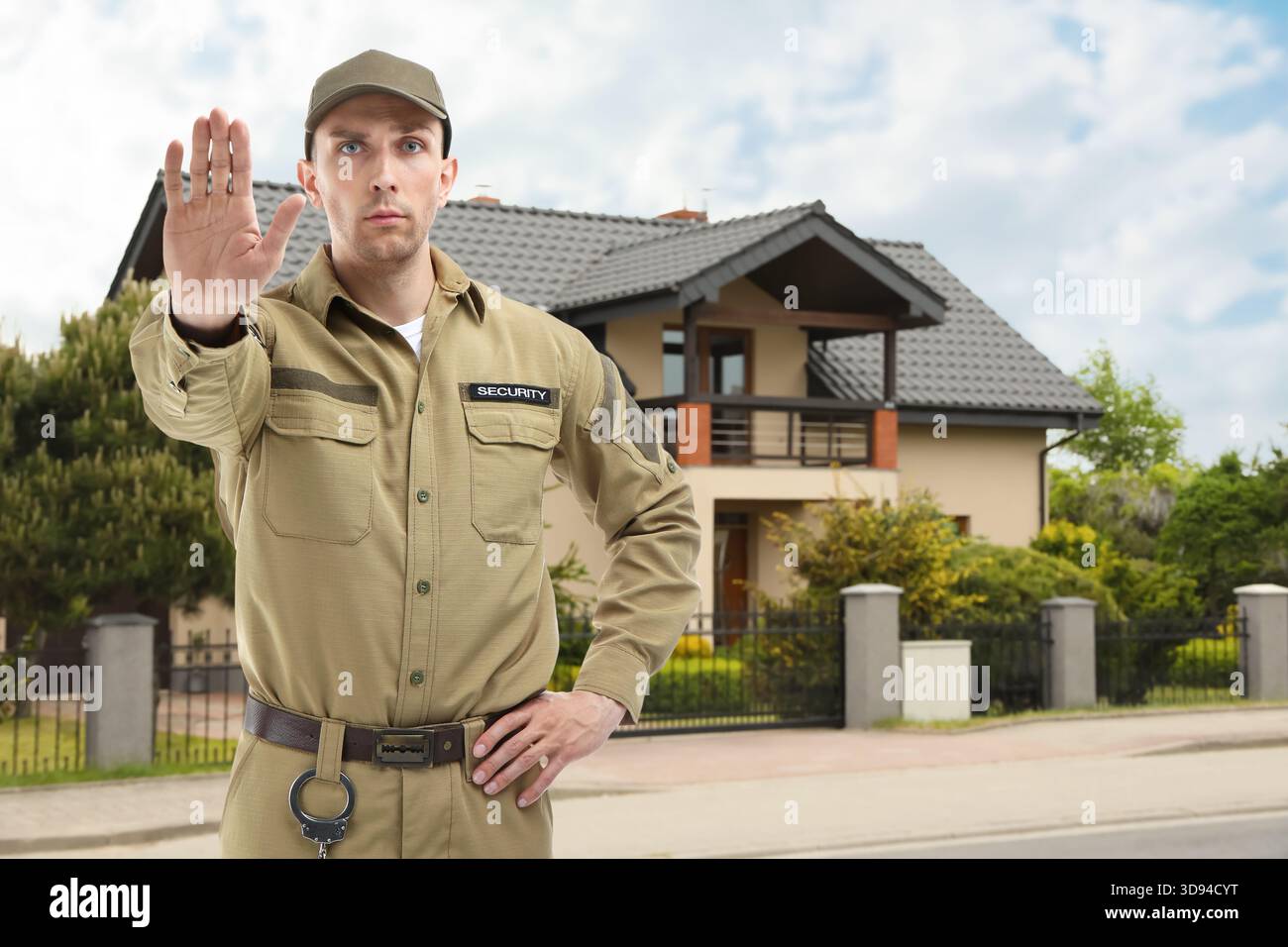 Security guard for private property protection. Man in uniform blocking ...