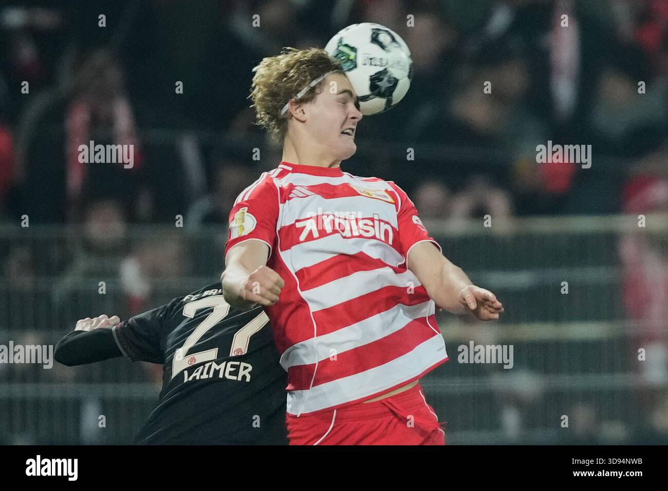 Union's Tom Rothe heads the ball during the German soccer cup round of ...