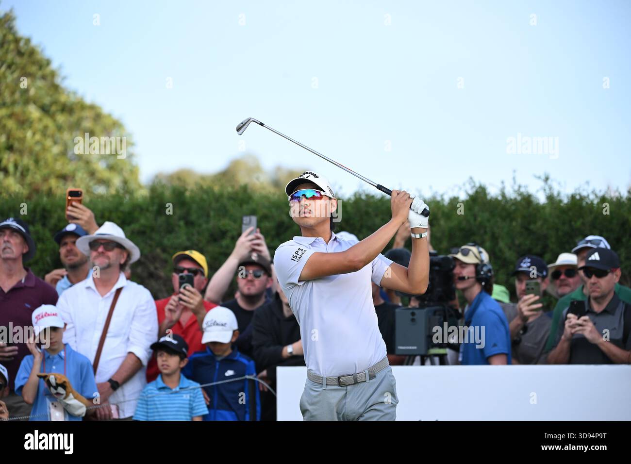 Min Woo Lee of Australia plays a shot in round one of the Australian ...