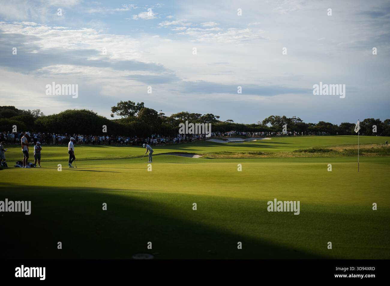 Min Woo Lee, of Australia, putts on the 10th hole during the first ...