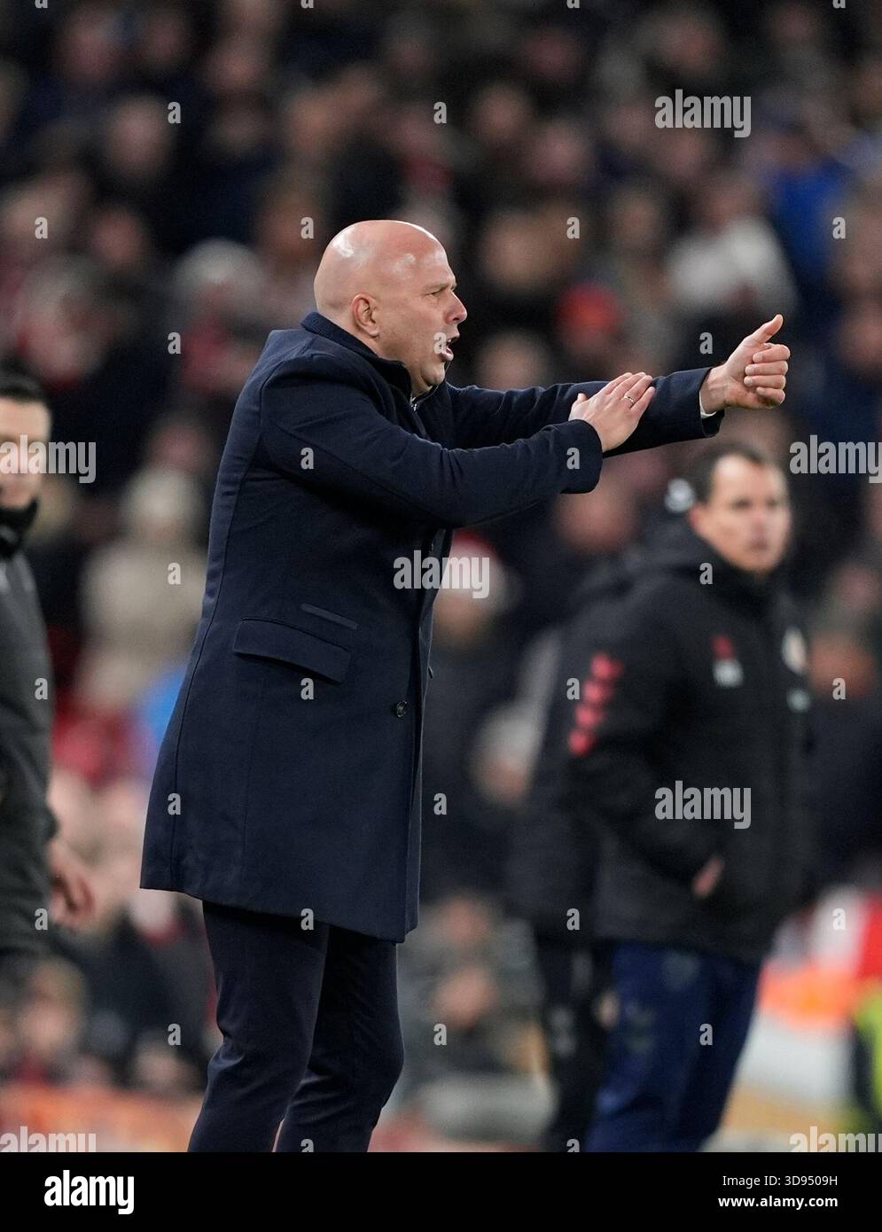 Liverpool manager Arne Slot claims for hand ball on the touchline ...