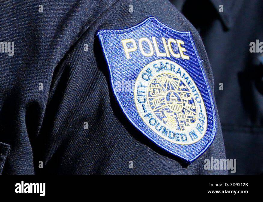 FILE - A Sacramento Police officer wears the department's badge in ...