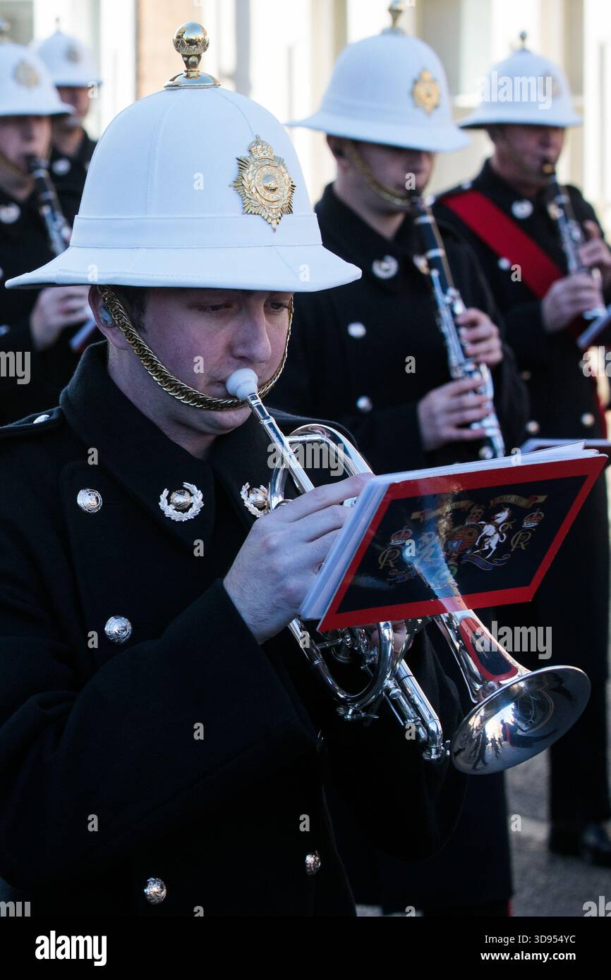 Windsor, UK. 3rd December, 2025. A Royal Marines band performs before a ...