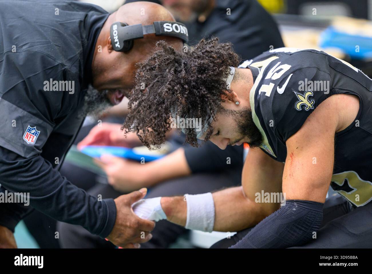 New Orleans Saints wide receiver coach Keith Williams talks to wide ...