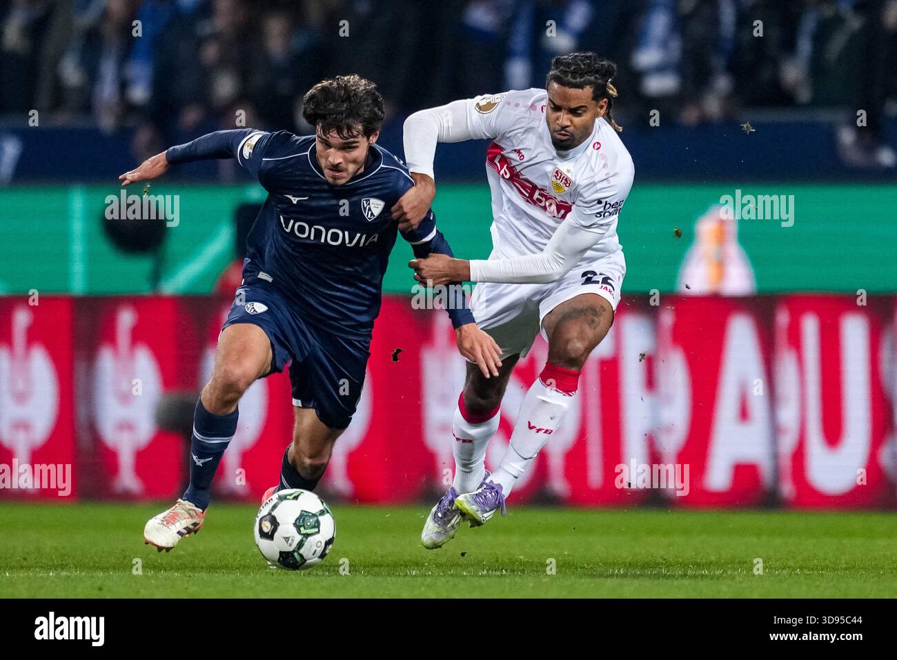 BOCHUM, GERMANY - DECEMBER 3: Kjell Watjen of VfL Bochum is challenged ...