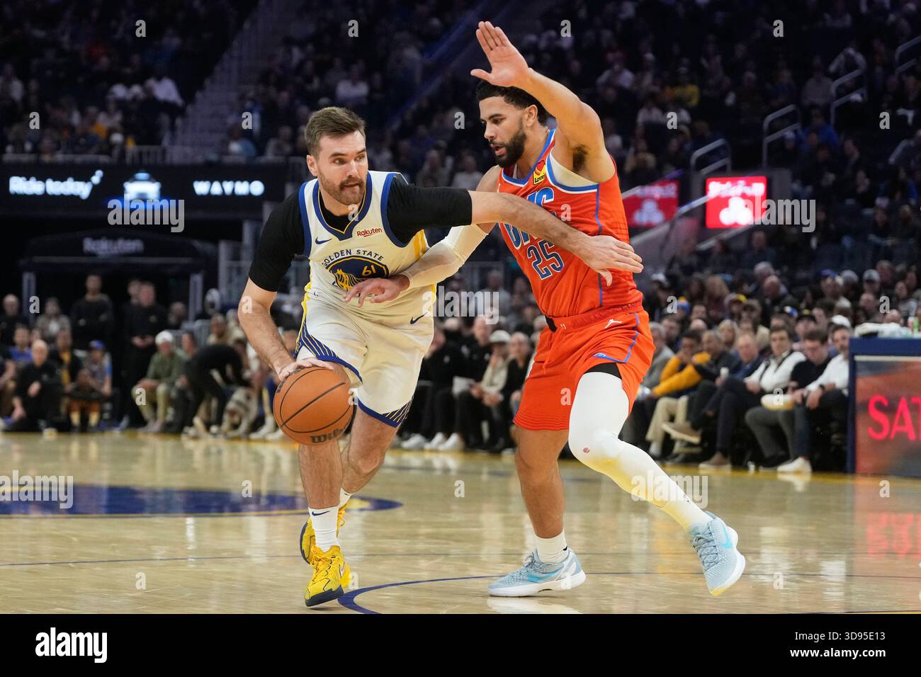 Golden State Warriors guard Pat Spencer, left, drives to the basket ...