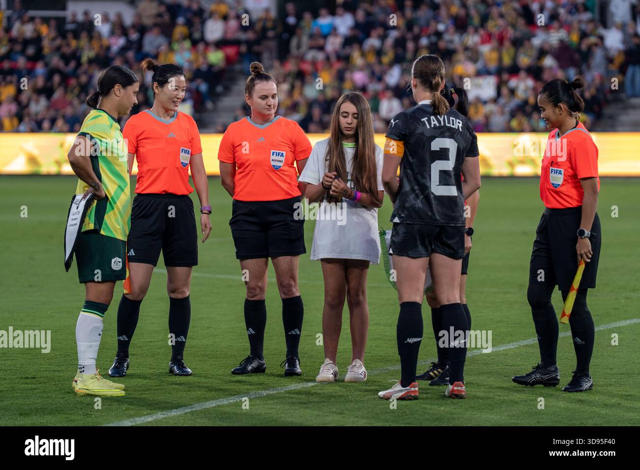 Sam Kerr (20 Australia), Kate Taylor (2 New Zealand) and the refereeing ...