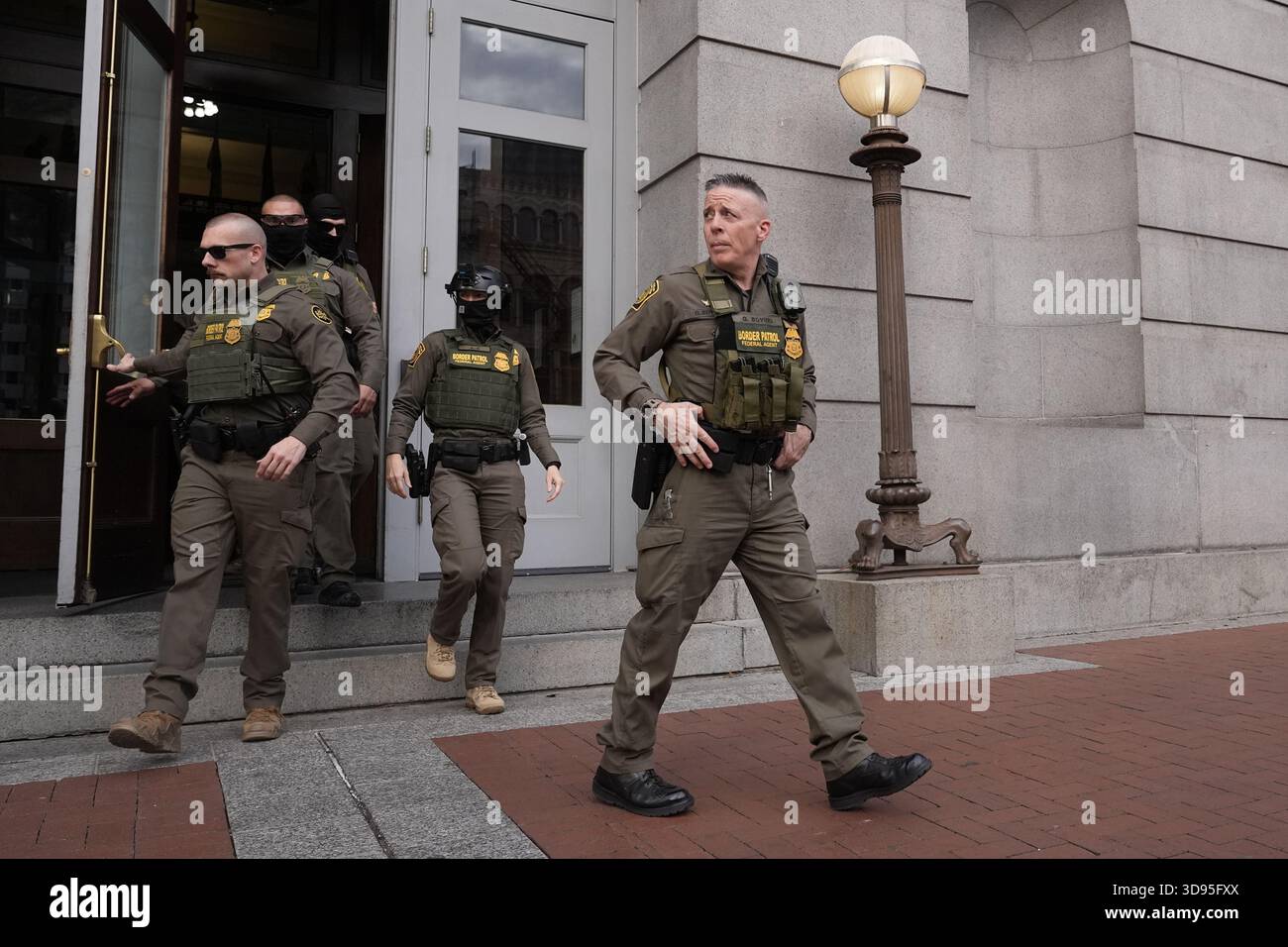 U.S. Border Patrol Commander at large Gregory Bovino, 1st right, walks ...
