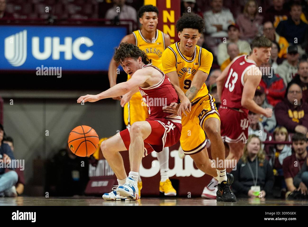 Indiana guard Conor Enright (5), left, loses control of the ball as ...