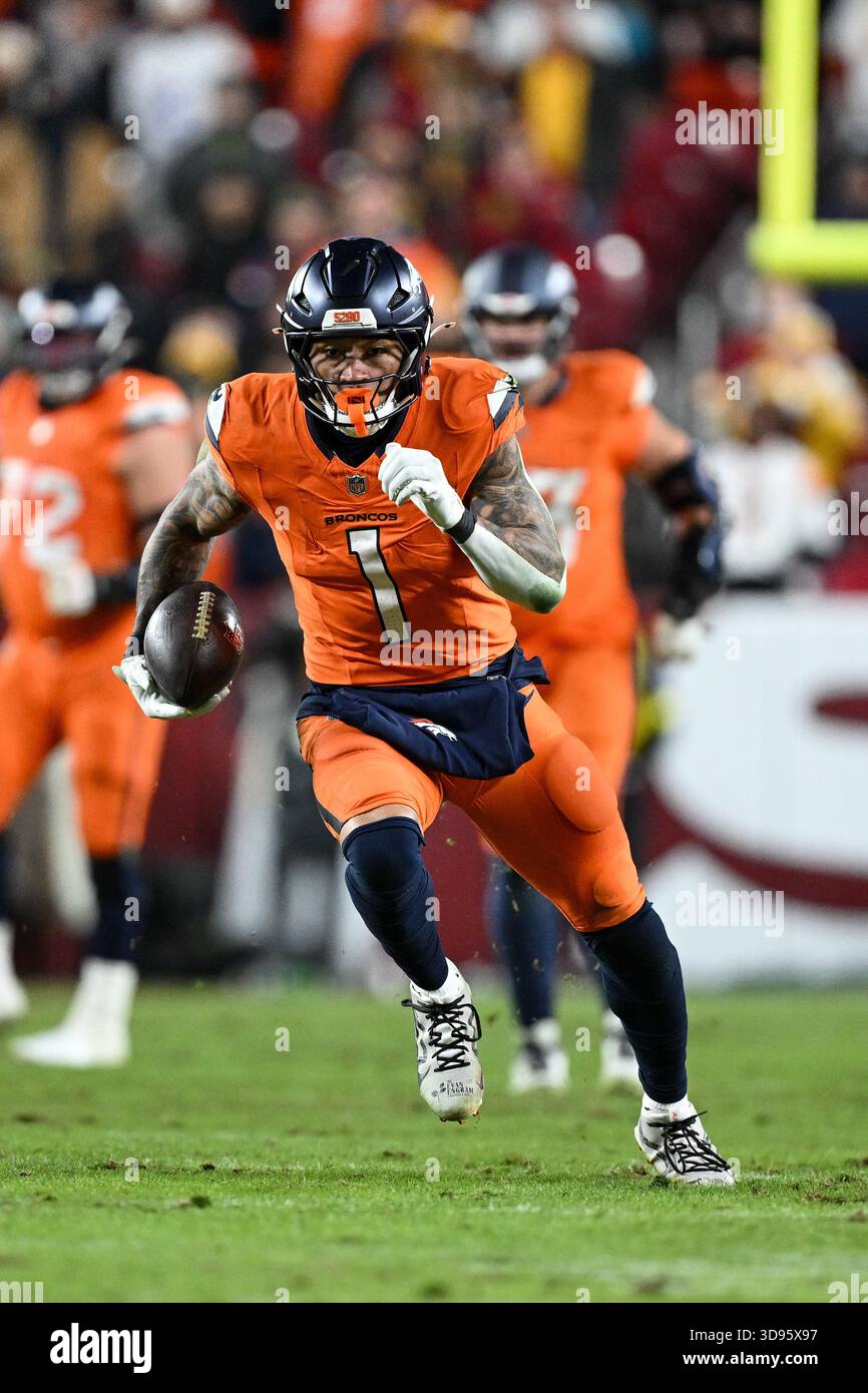 Denver Broncos tight end Evan Engram (1) runs with the ball after ...