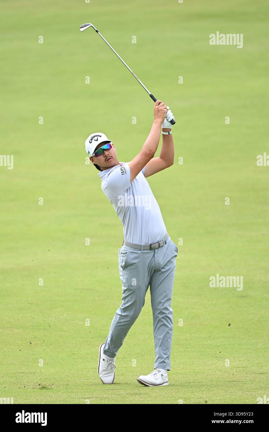 Min Woo Lee of Australia plays a shot in round one of the Australian ...