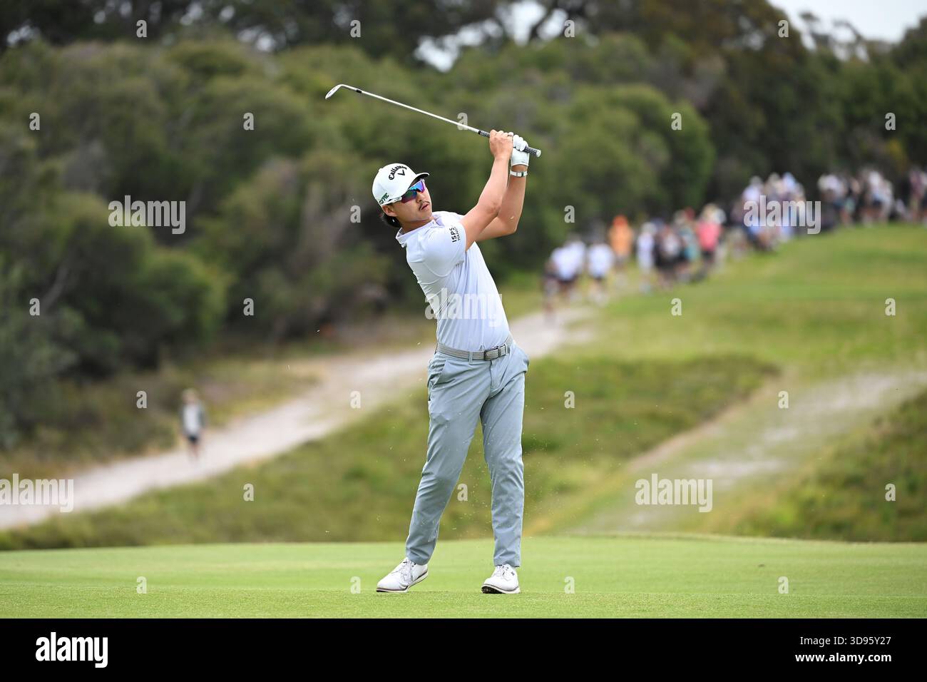 Min Woo Lee of Australia plays a shot in round one of the Australian ...