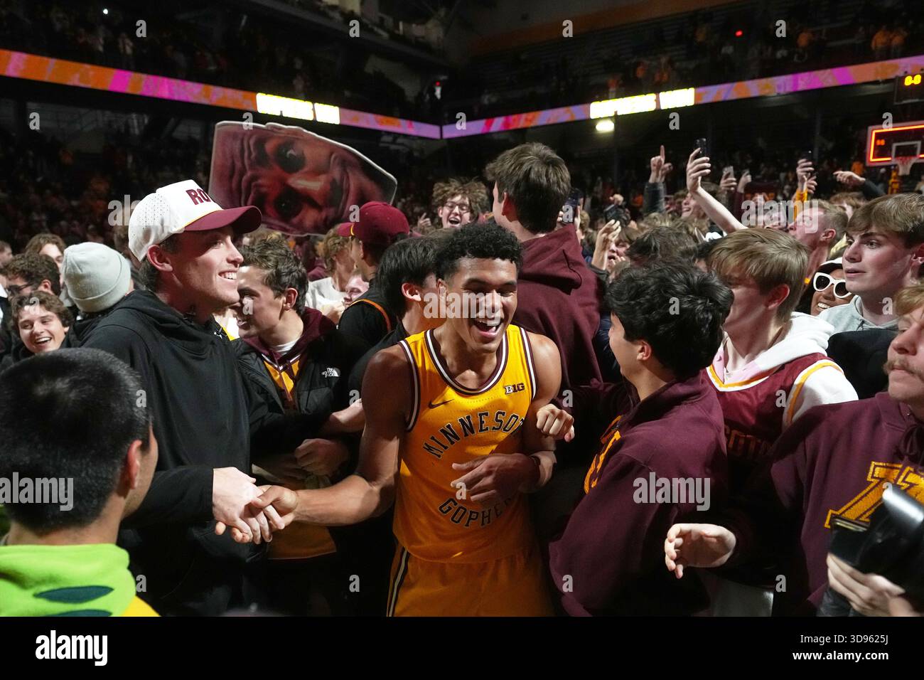 Minnesota guard Isaac Asuma (1) celebrates with fans after an NCAA ...