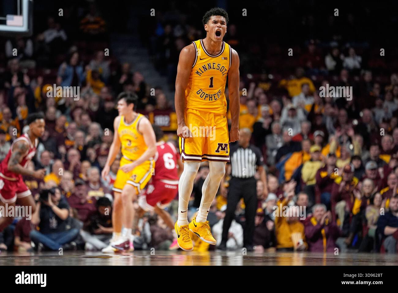 Minnesota guard Isaac Asuma (1) celebrates after making a 3-point shot ...