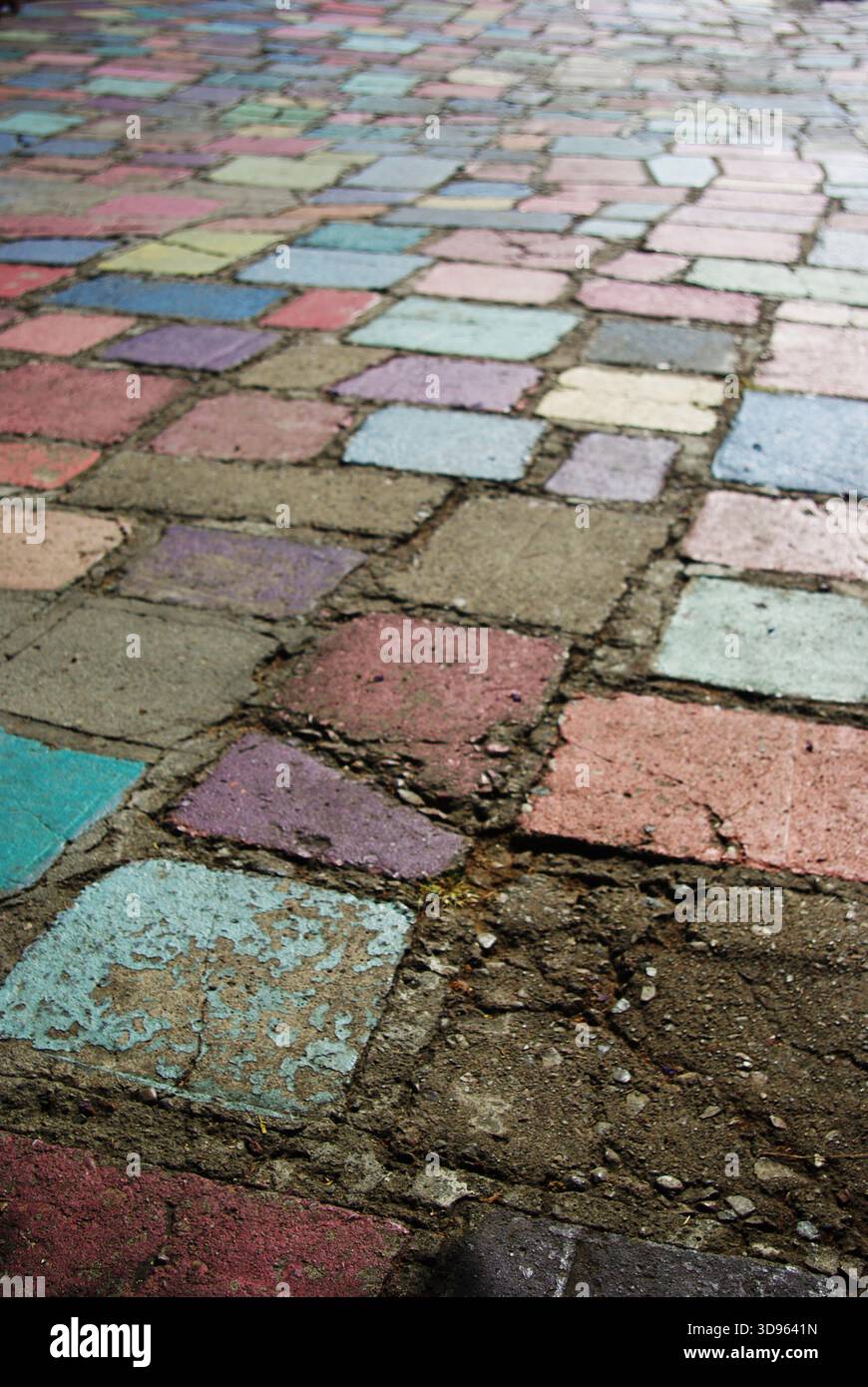 Colorful, artistic pavement texture. Old cobblestones painted in ...