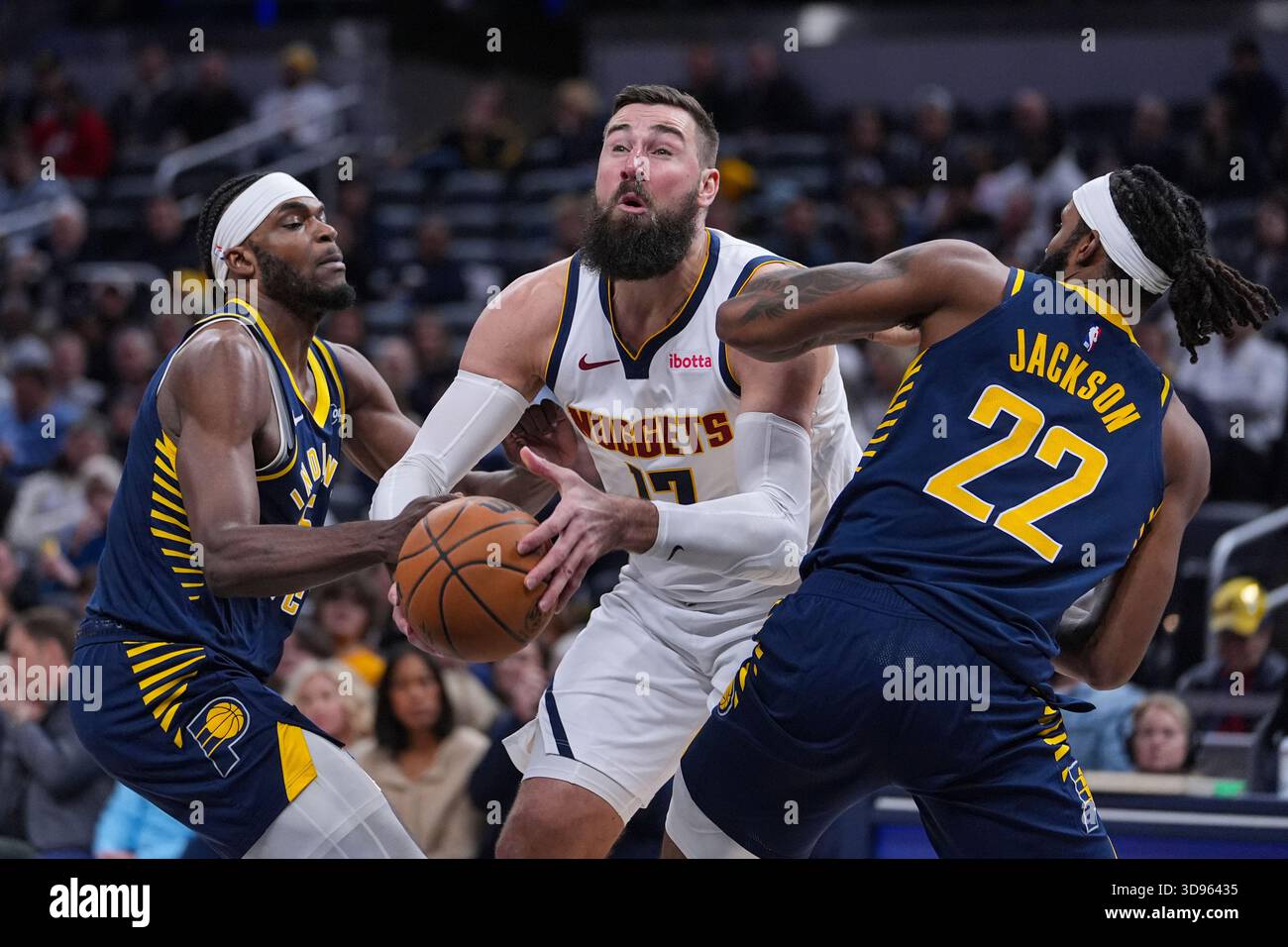 Denver Nuggets center Jonas Valanciunas (17) as he tries to shoot ...