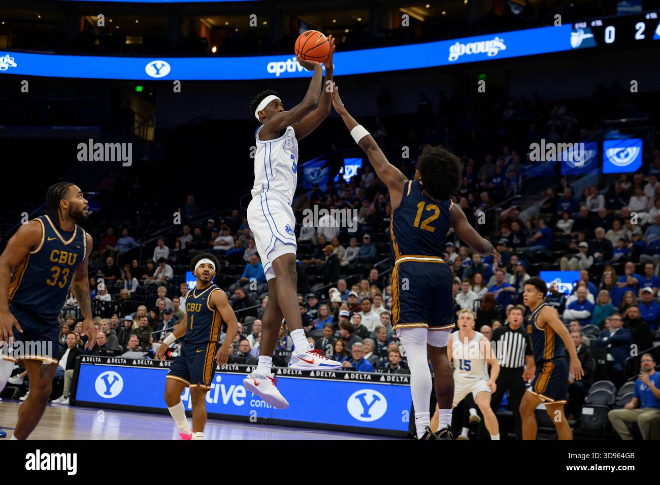 Brigham Young forward AJ Dybantsa, center, shoots the ball over ...