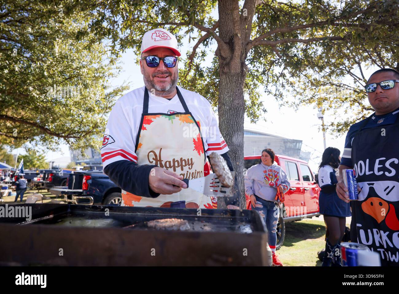 Alberto Munoz flips burgers outside AT&T Stadium before an NFL football ...