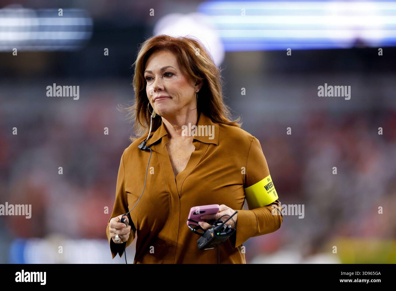 Dallas Cowboys cheerleaders director Kelli Finglass walks off the field ...