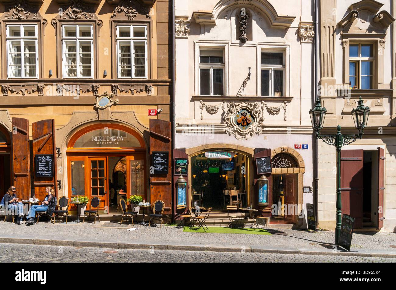Prague, CZ - Jun 3, 2023 Historic Nerudova Street with cafés and the ...