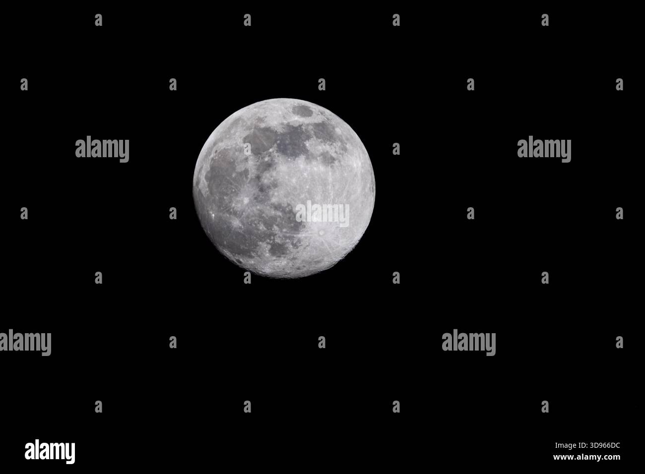Cold supermoon, last full moon of 2025, isolated against black night ...