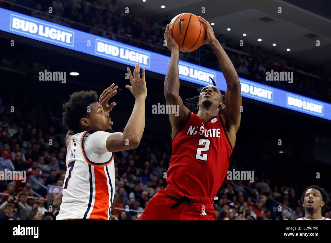 NC State guard Jr. Paul McNeil (2) shoots over Auburn guard Keyshawn ...