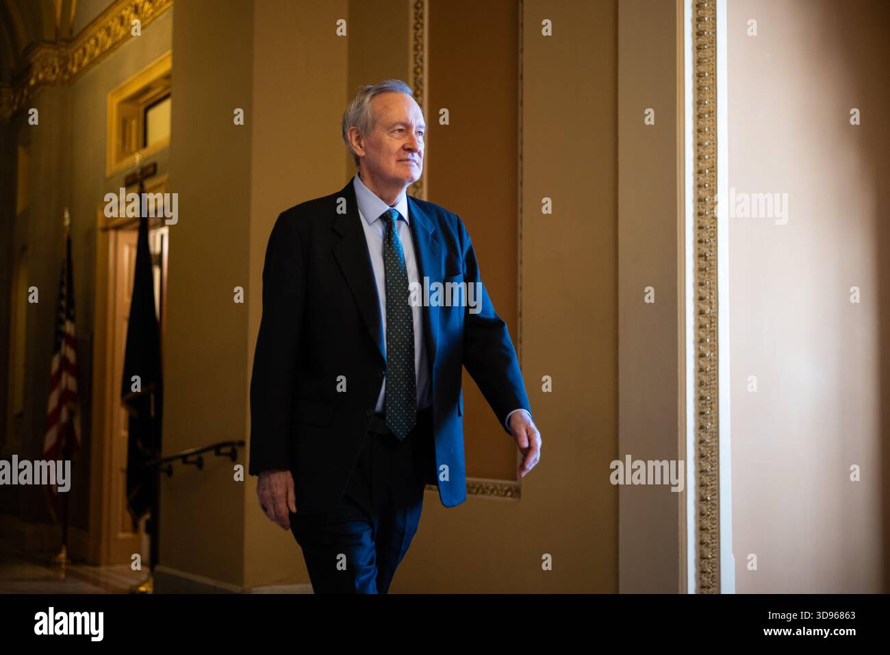 Sen. Mike Crapo (R-Idaho) walks to a Senate Republican Conference ...