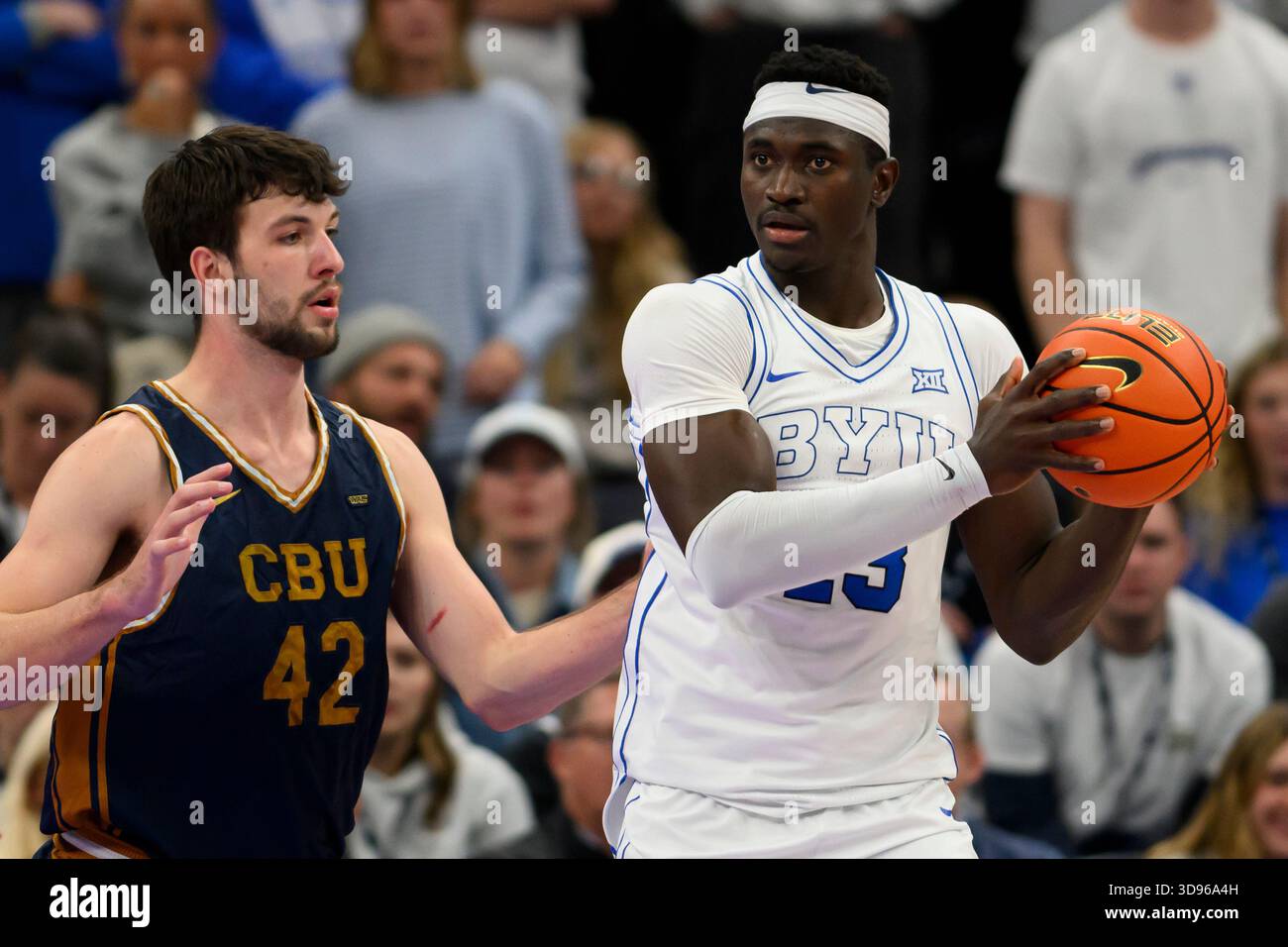 Brigham Young center Keba Keita, right, posts up against California ...