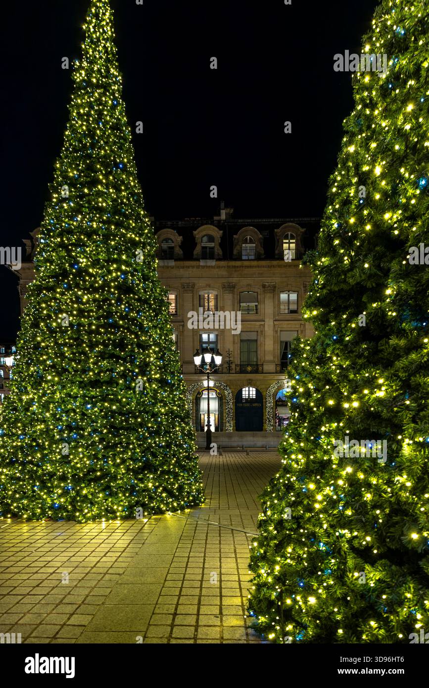 Paris, France - November 20, 2025: Christmas trees decorated with ...