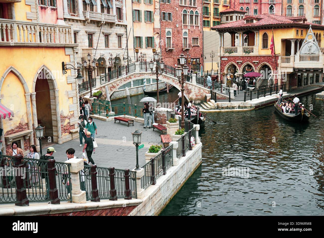 Tourists walk through the Venice canals at the Mediterranean Harbor ...