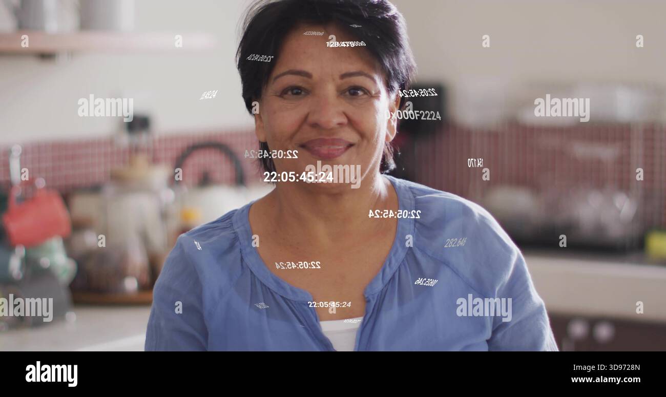 Standing woman facing camera in kitchen, wearing blue blouse, timestamp ...