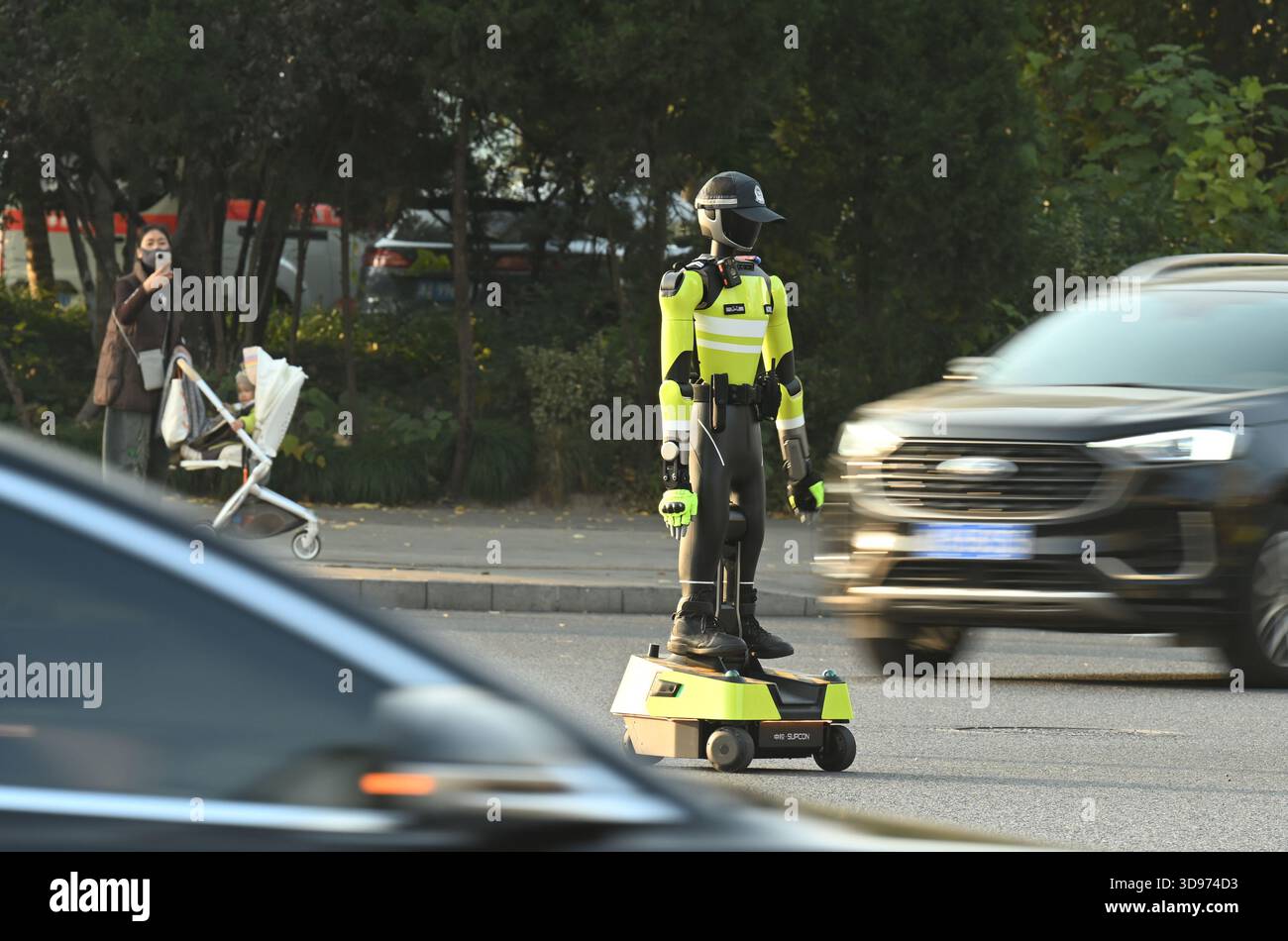 Hangzhou,China.3rd December 2025. A robot traffic officer using ...