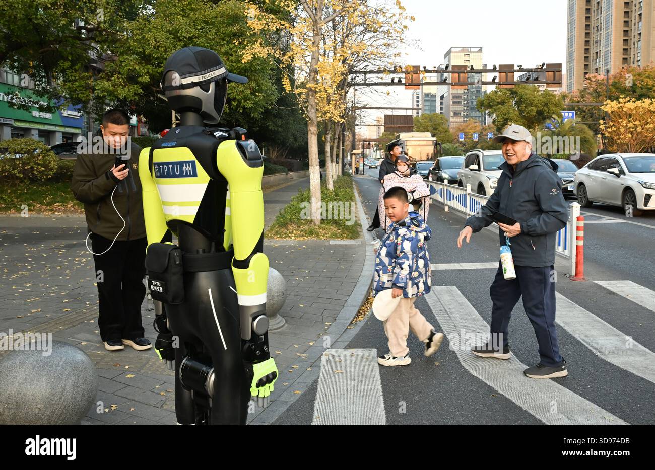 Hangzhou,China.3rd December 2025. A robot traffic officer using ...