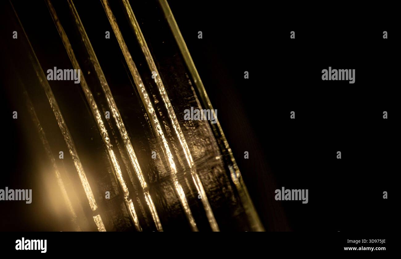 Close-up of the screw thread (neck finish) of a transparent glass jar ...