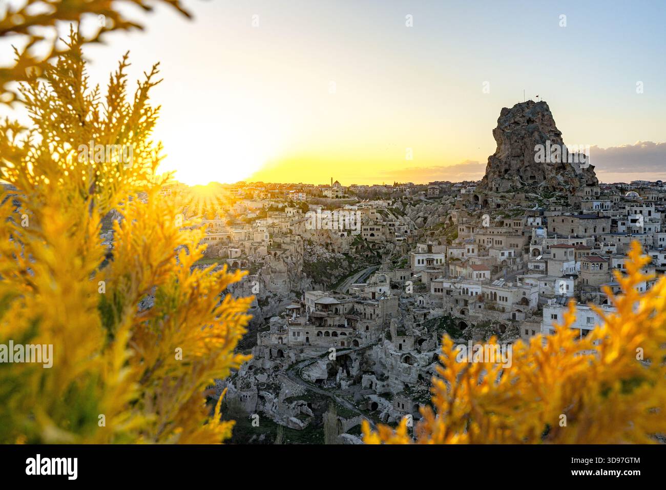 View of warm sunlight bathing the ancient stone dwellings clustered ...
