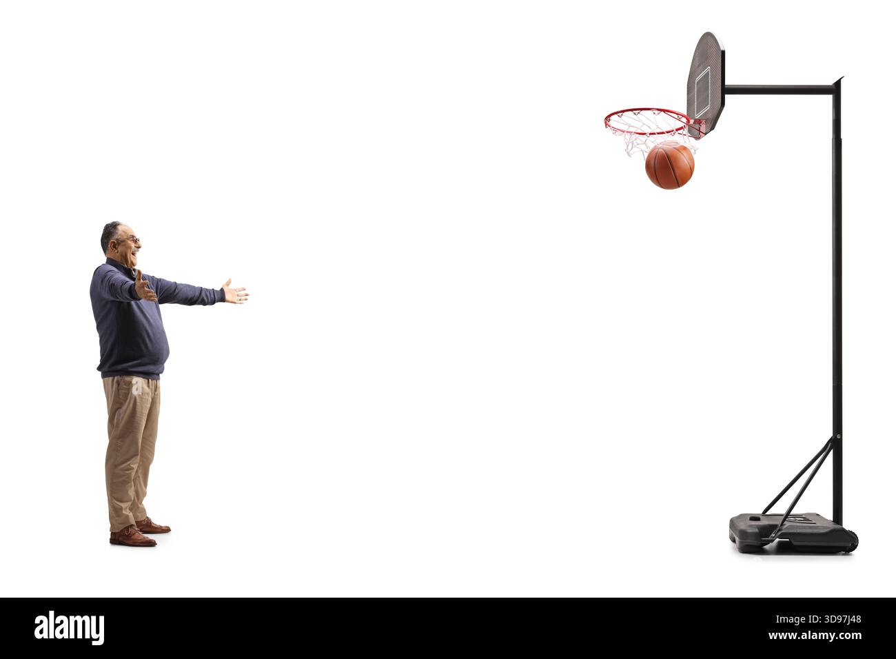 Happy man scoring a point with a basketball isolated on white ...
