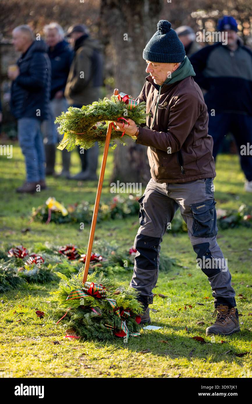 25/11/25 Buyers bid for mistletoe, holly, and wreaths at the annual ...