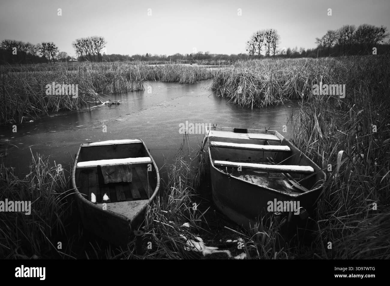 Lake two boats on shore Black and White Stock Photos & Images - Alamy