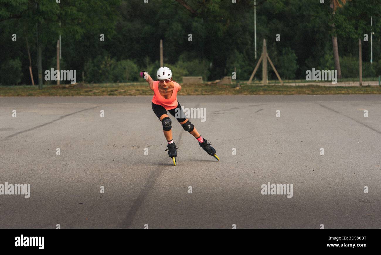 Woman performing inline skating hi-res stock photography and images - Alamy
