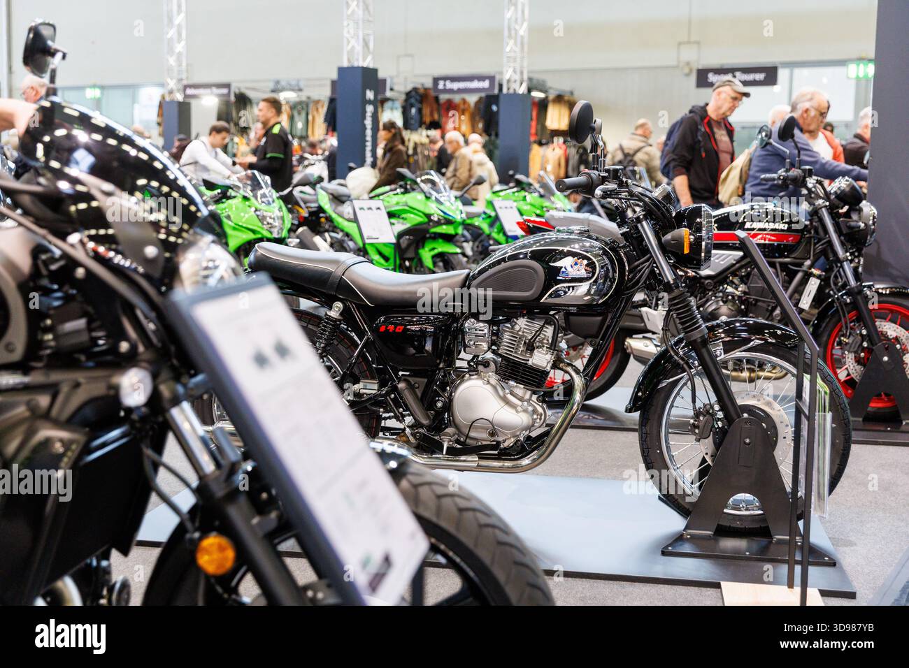 Visitors explore Triumph Motorcycles models, including modern classics ...