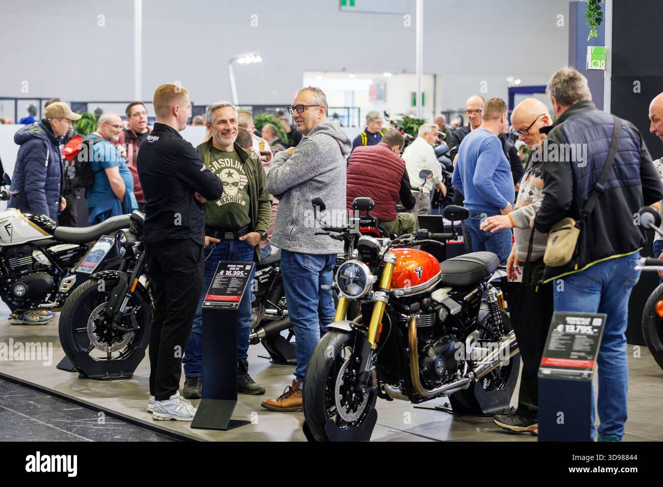 Visitors explore Triumph Motorcycles models, including modern classics ...