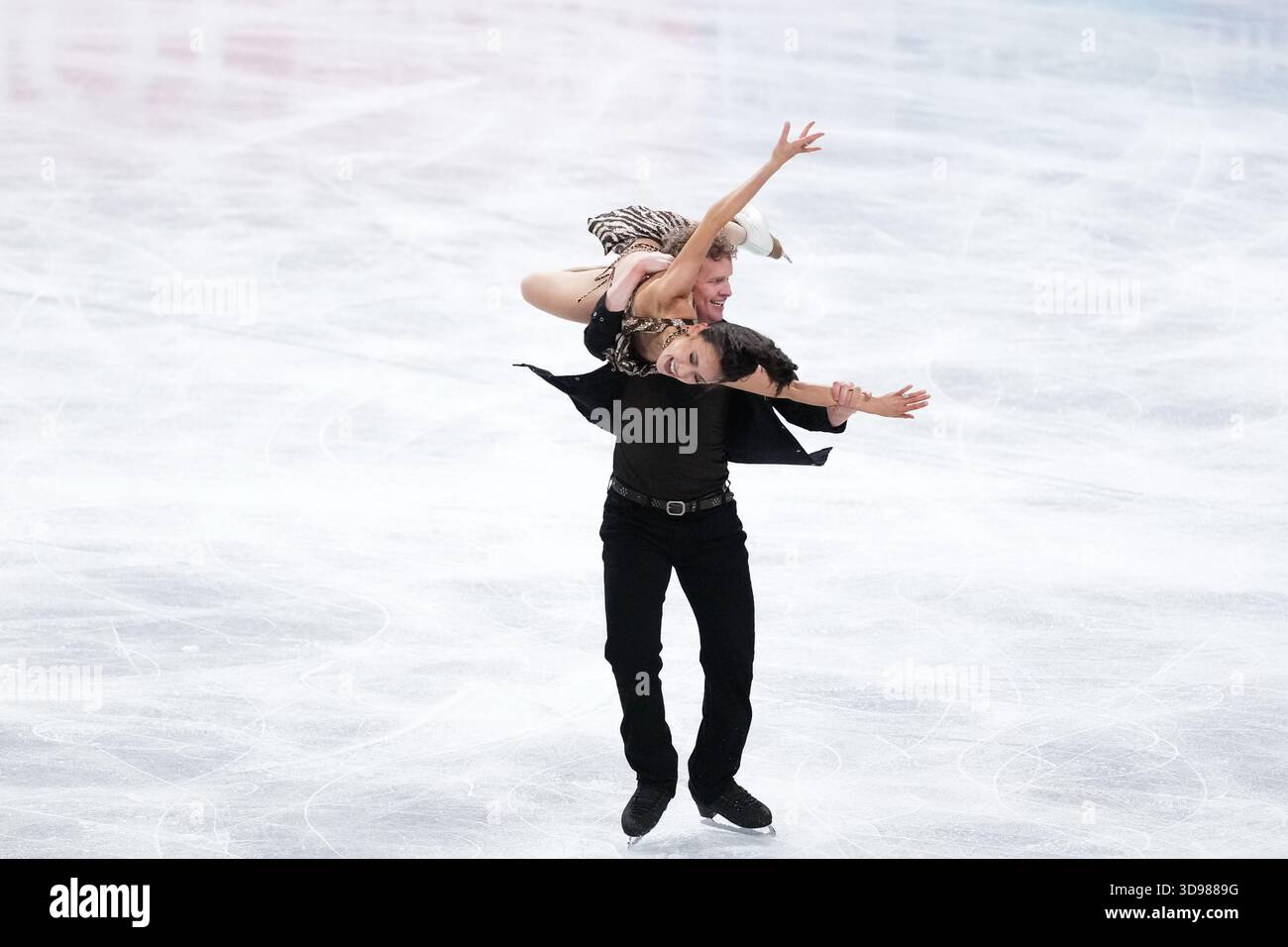 Madison Chock and Evan Bates, of the United States, compete in the ice ...