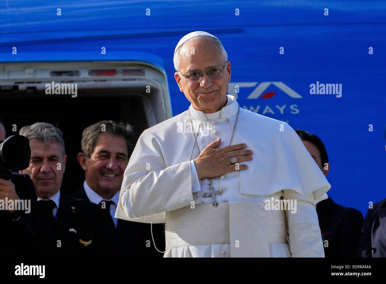 FILE - Pope Leo XIV gestures as he boards a flight back to the Vatican ...